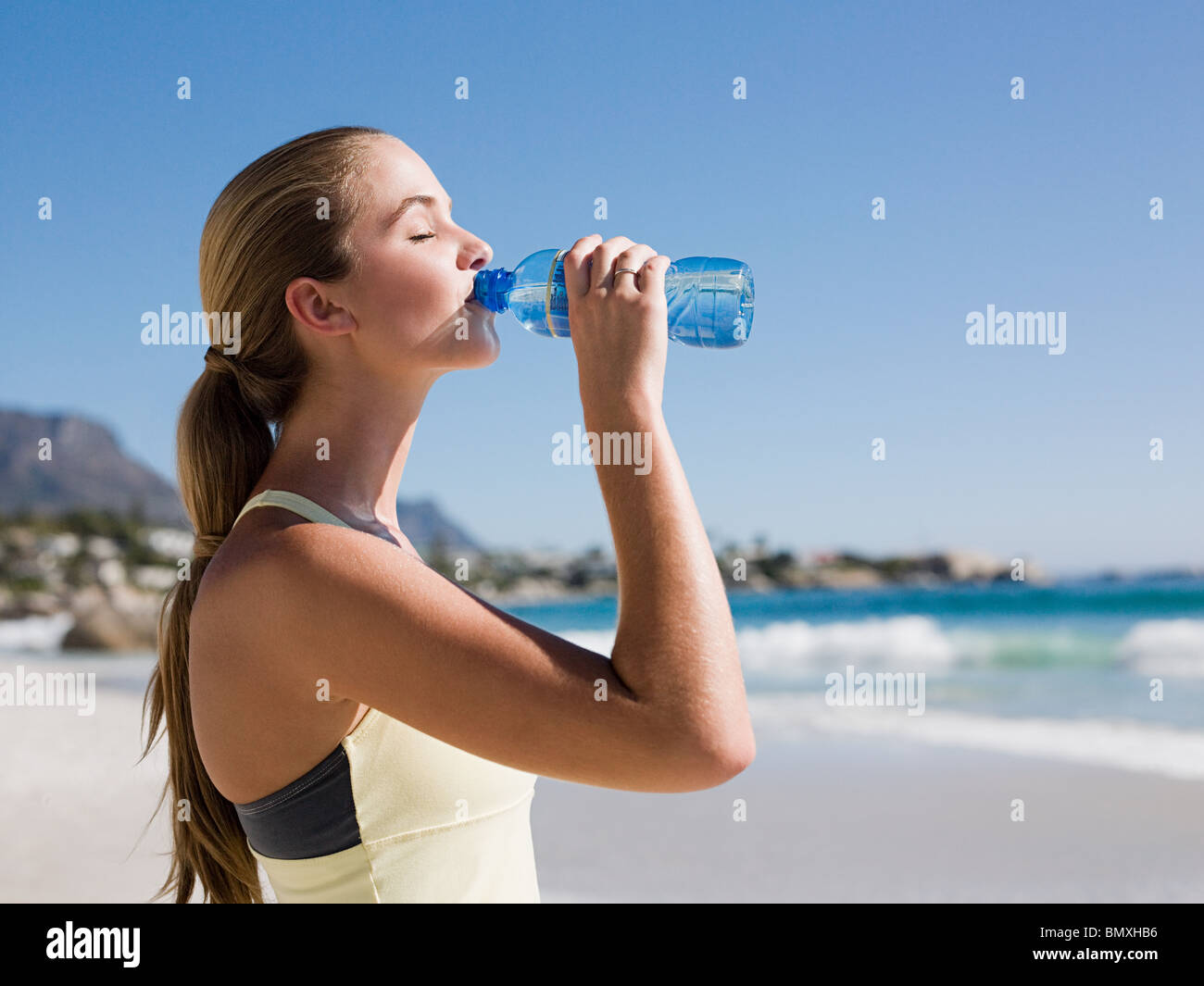 Young woman drinking water Stock Photo - Alamy