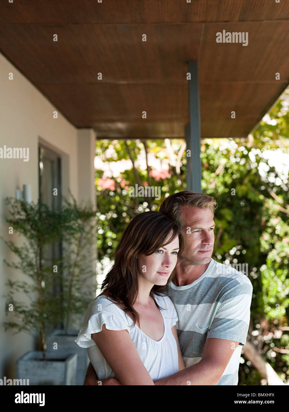 Couple outside house Stock Photo - Alamy