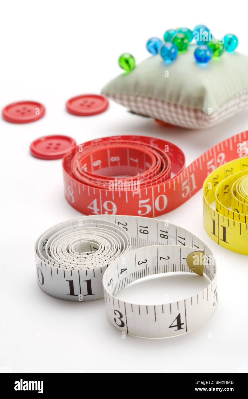 Tape Measure, Buttons, and a pincushion Stock Photo - Alamy