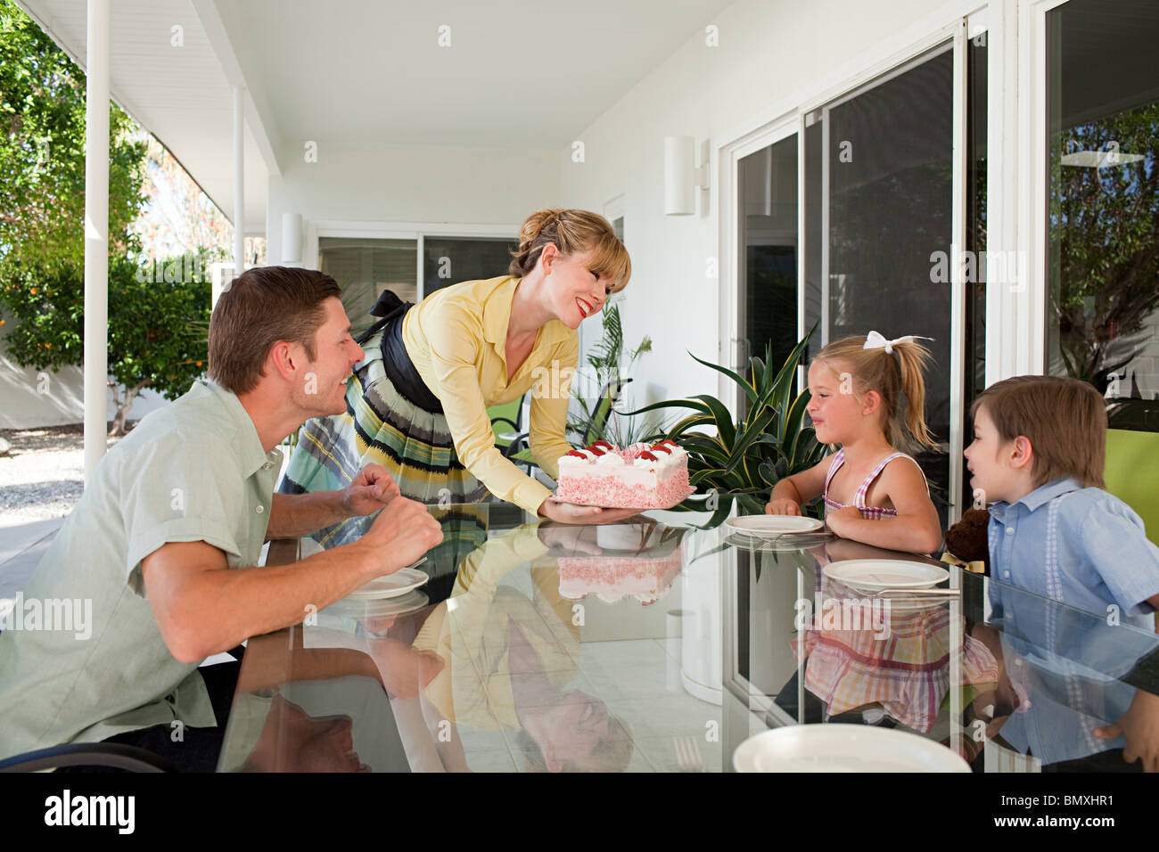 Family having birthday cake Stock Photo - Alamy
