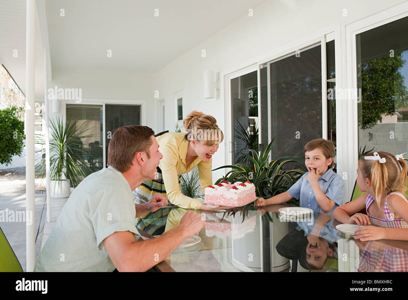 Family having birthday cake Stock Photo - Alamy