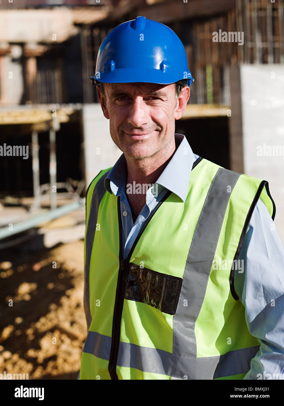 Mature man on construction site, portrait Stock Photo - Alamy