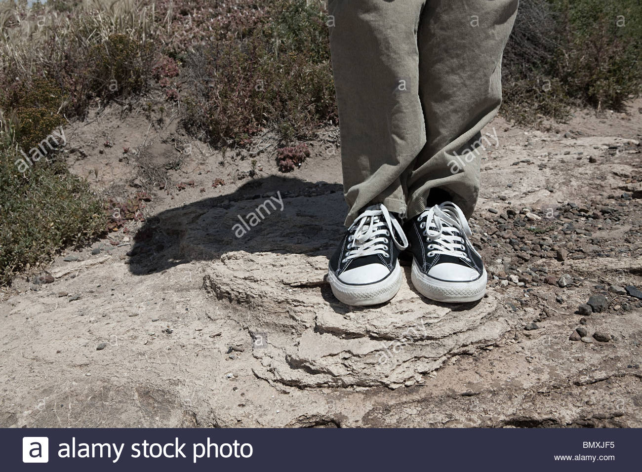 Young Man Standing One Leg Stock Photos & Young Man Standing One Leg ...