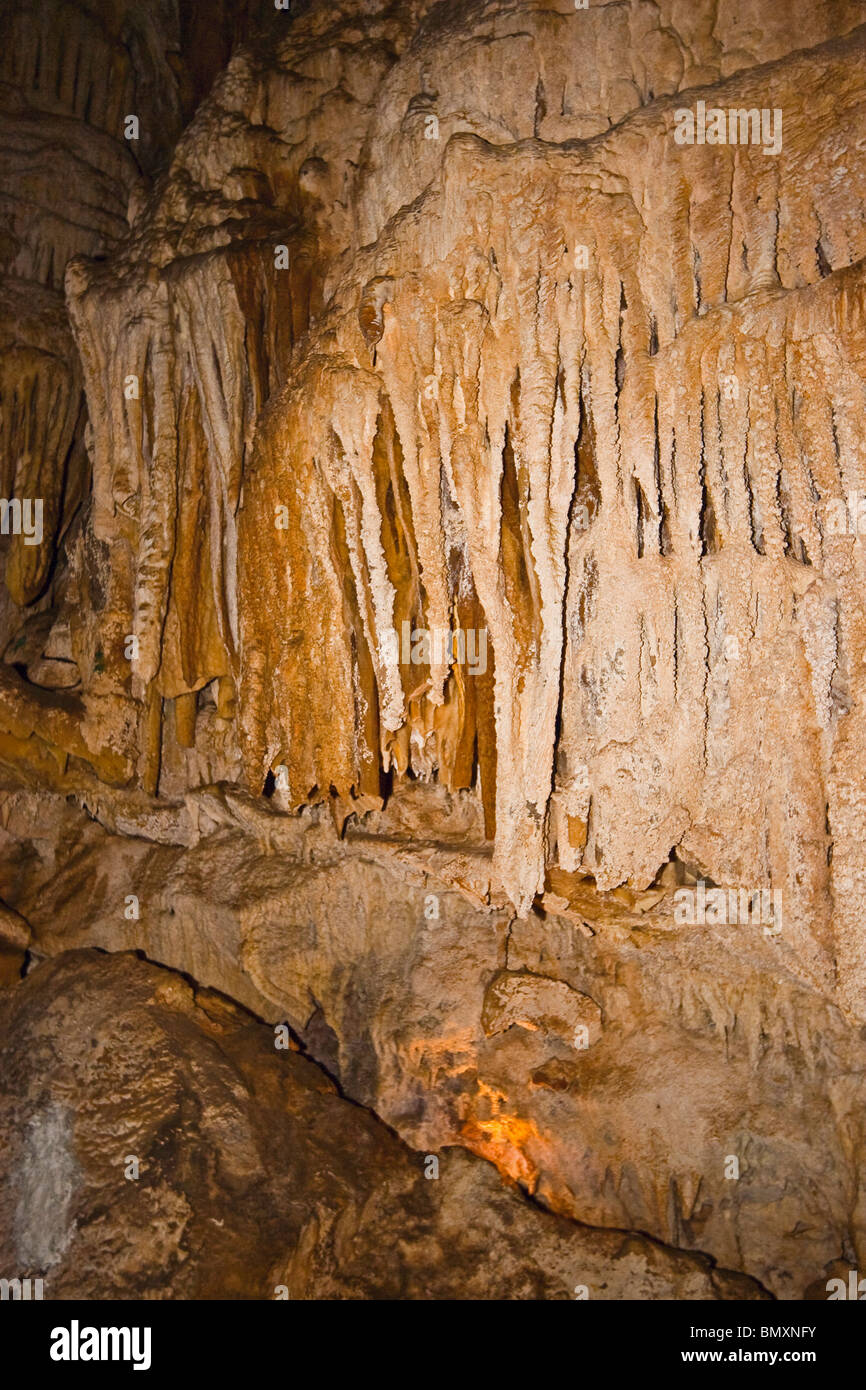 A flowstone feature with resulting stalactites at Ngilgi Cave, a ...