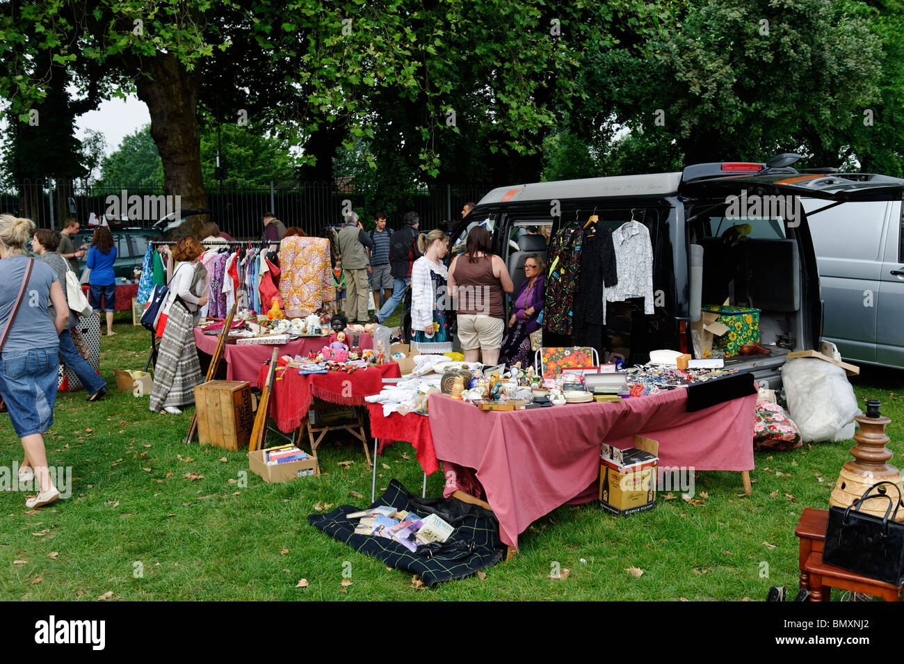 Car boot sale shoppers examine the wares in Chiswick, West London Stock ...
