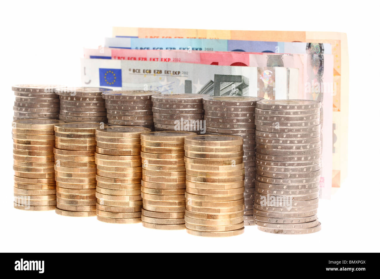 Euro banknotes and coins organized in columns isolated on white ...
