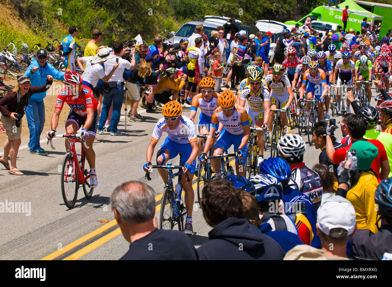 Professional cyclists and spectators at the Amgen Tour of California ...