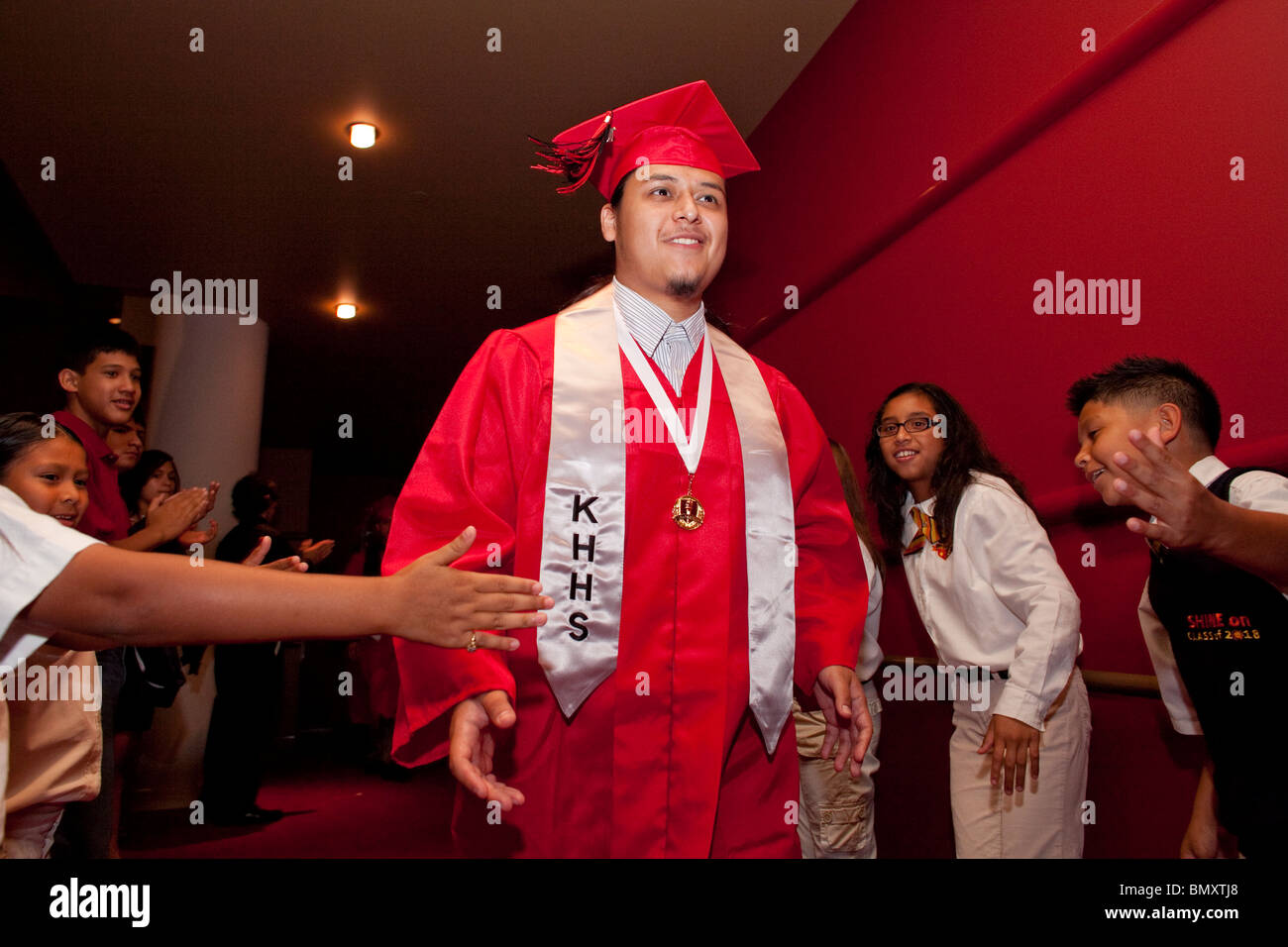 Hispanic boy graduates from KIPP Academy, a nationally-recognized ...