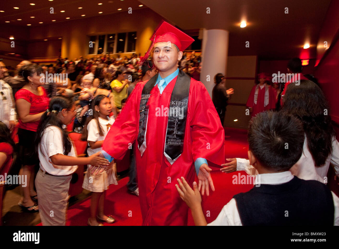 Hispanic boy graduates from KIPP Academy, a nationally-recognized ...