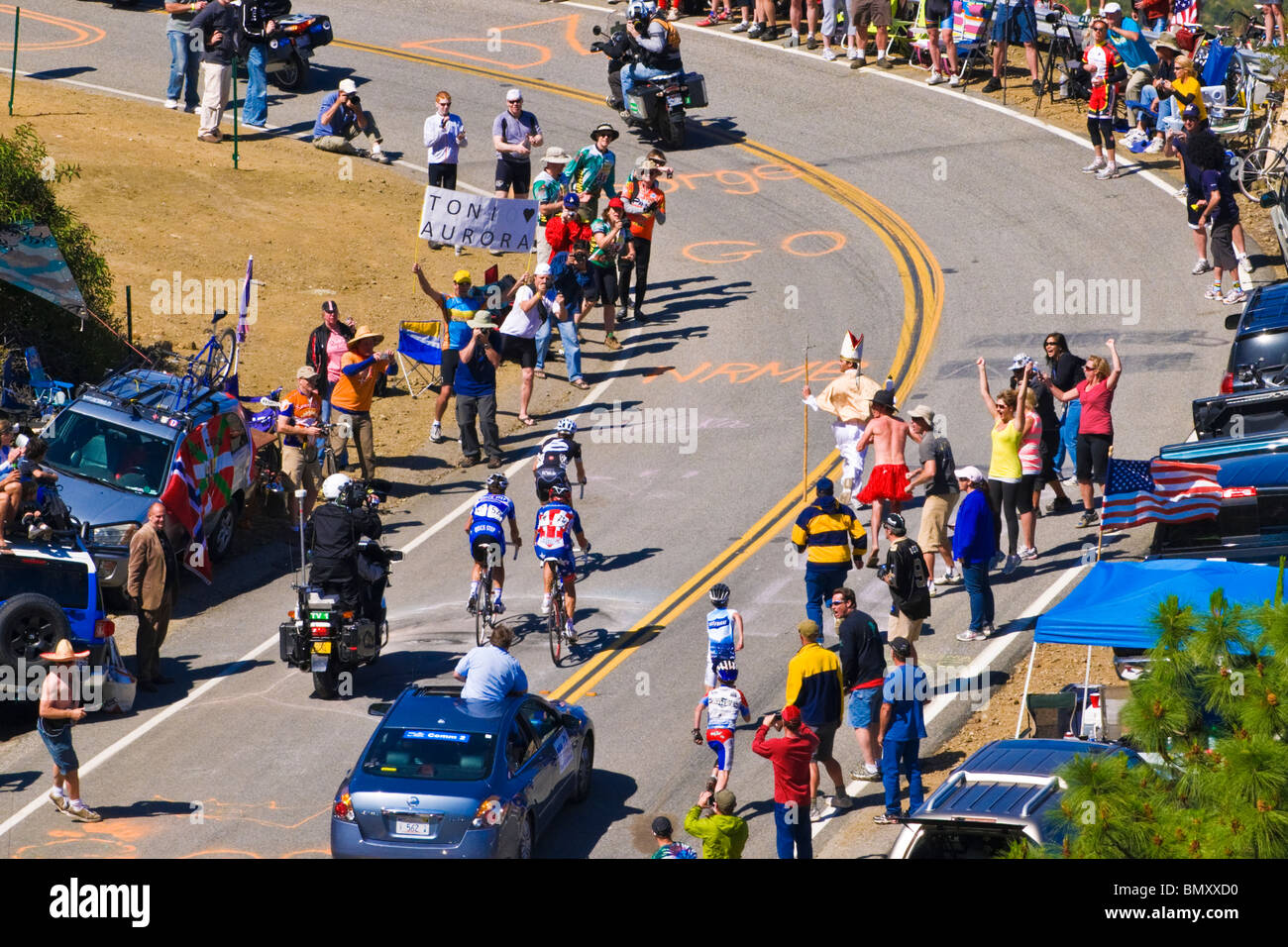 Professional cyclists and spectators at the Amgen Tour of California ...