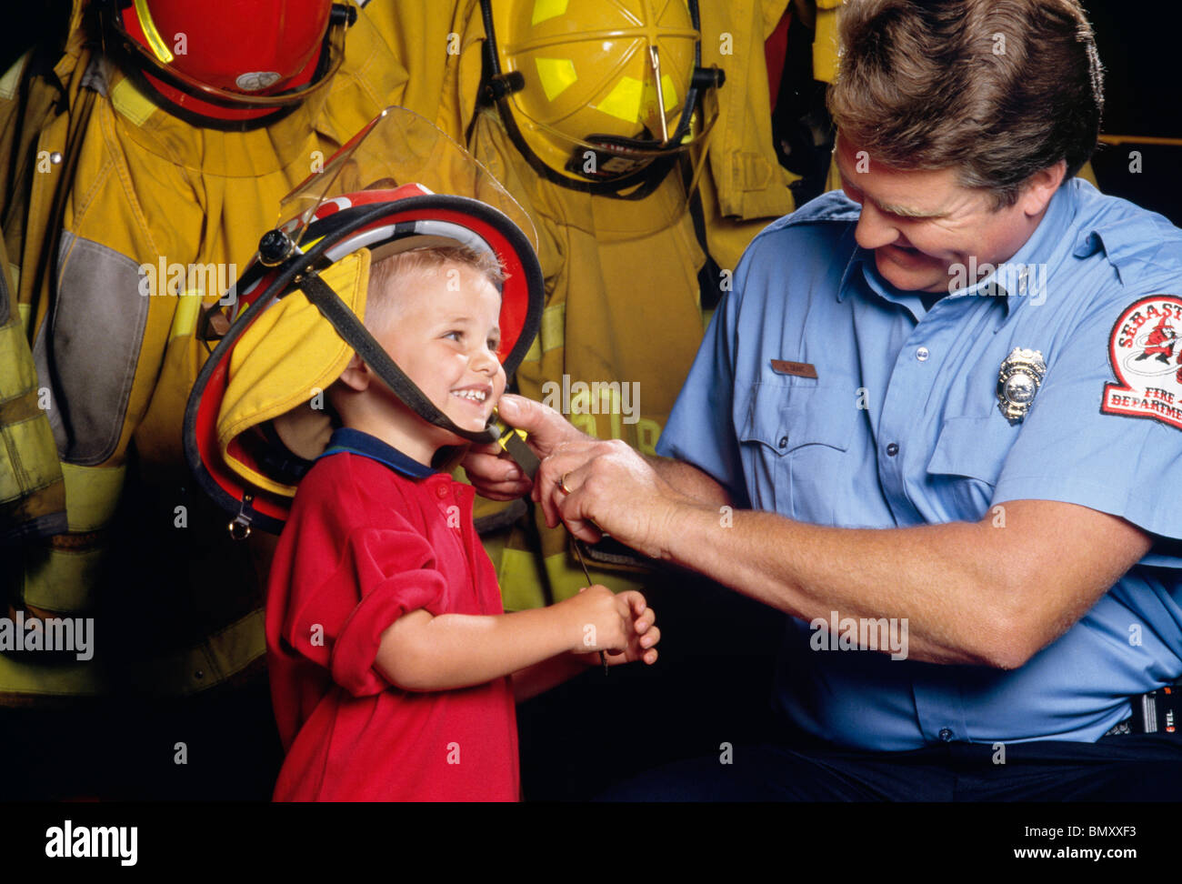 Fireman kneeling hi-res stock photography and images - Alamy