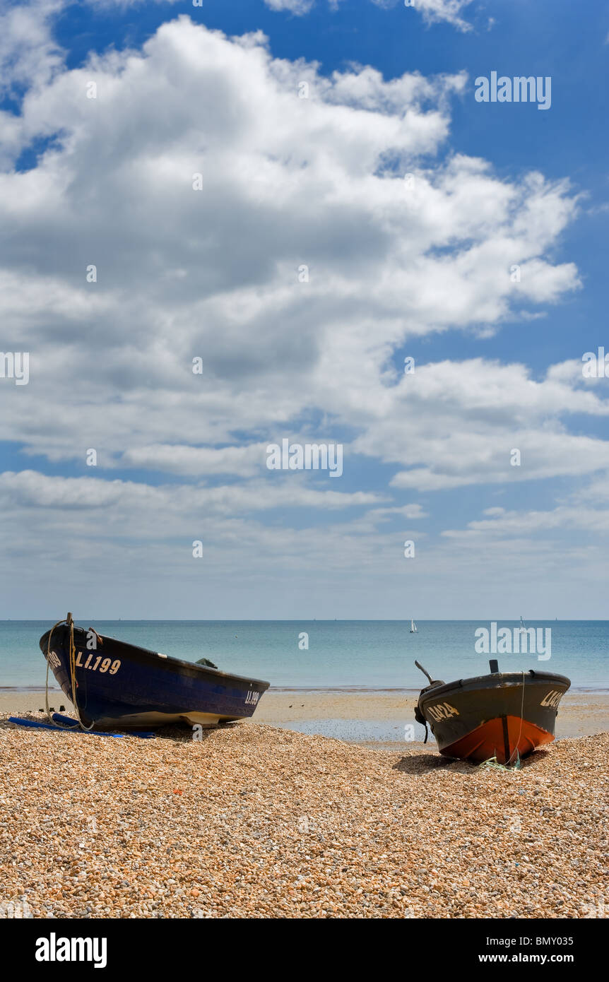 Two fishing boats beached on a shingle beach. Photo by Gordon Scammell ...