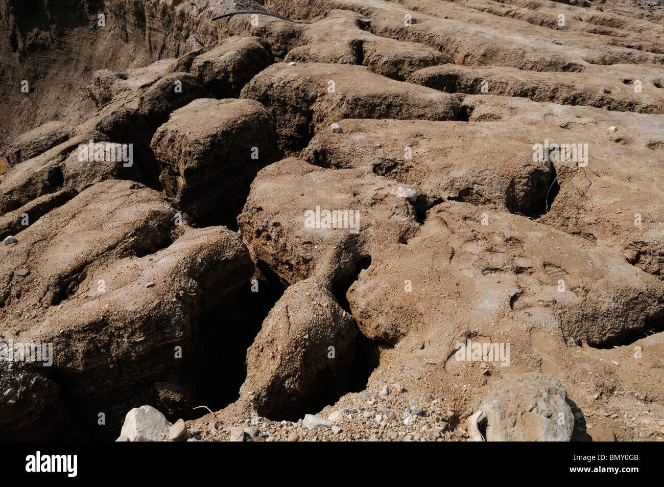 Sinkholes formed by dissolution of underground salt at the coast of the ...