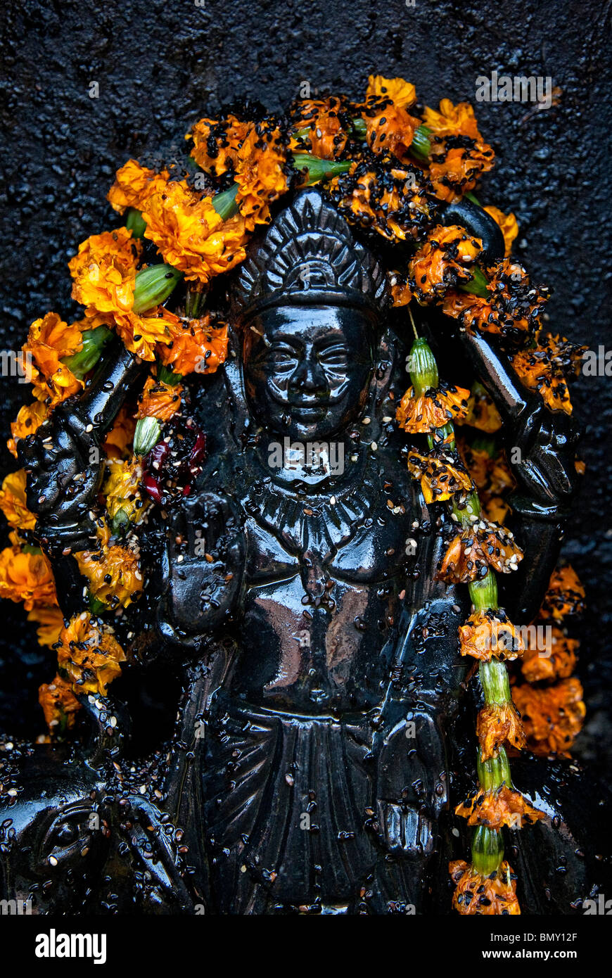 Black shiva sculpture flower garland hi-res stock photography and ...