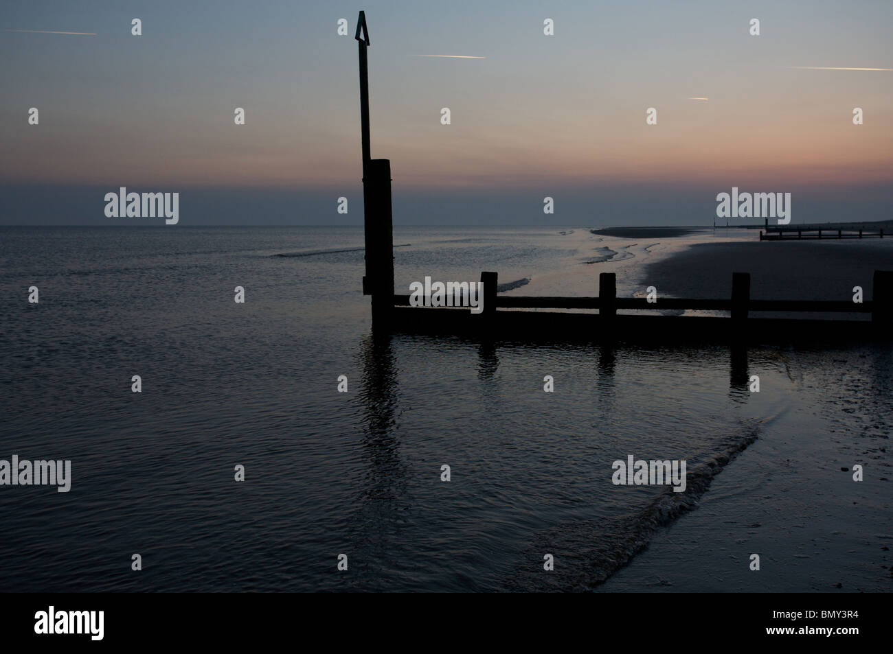 High tide at sunrise on Rhyl beach Stock Photo - Alamy