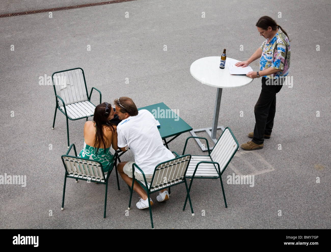 A couple and a stranger Stock Photo - Alamy