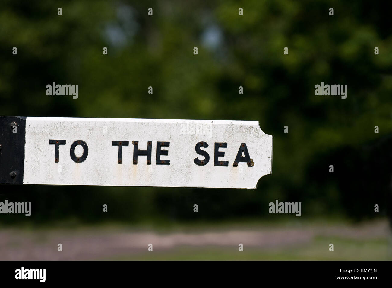 A sign pointing the way to the sea. Photo by Gordon Scammell Stock ...