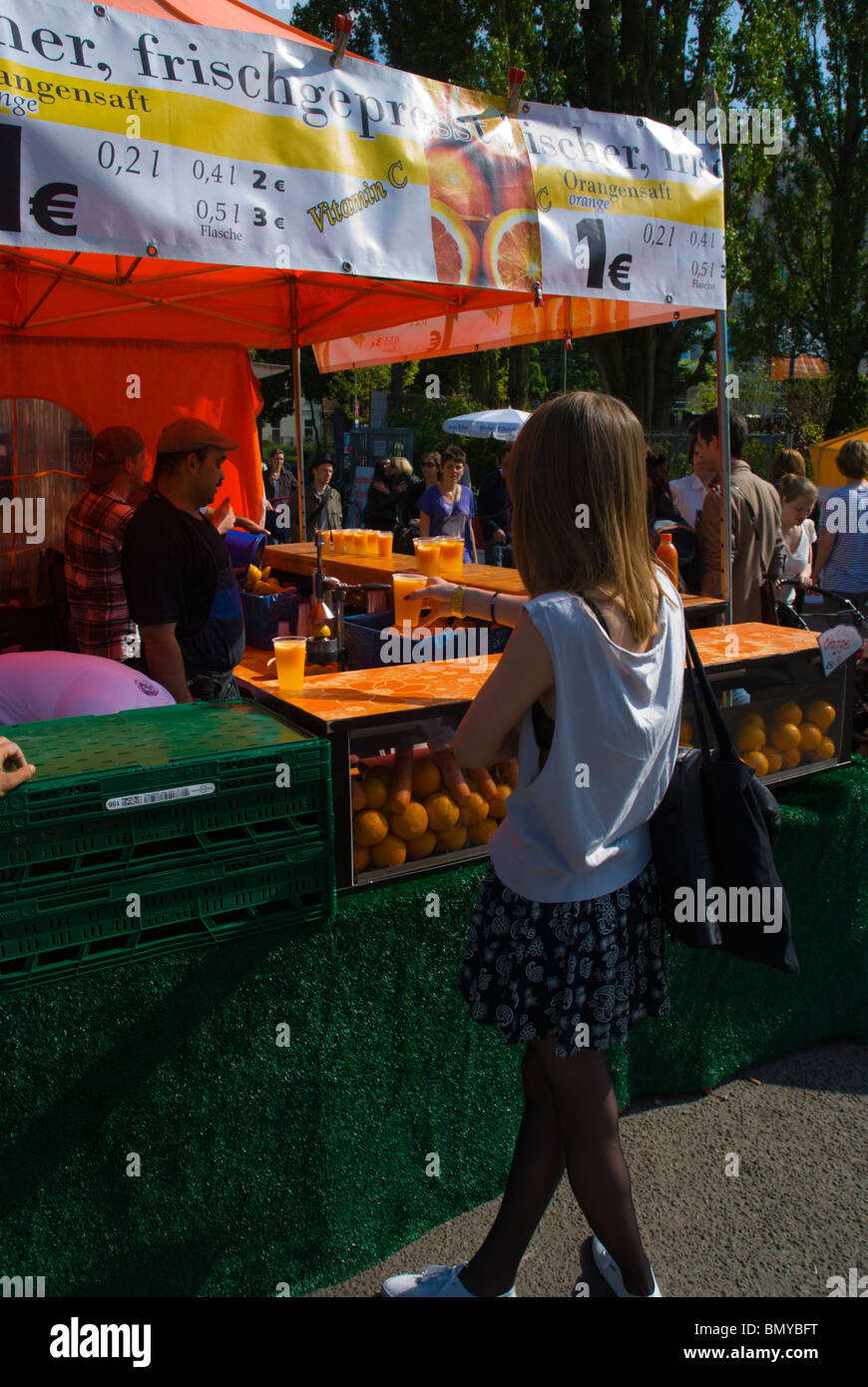 Freshly pressed orange juice stand Mauerpark flea market Mitte central ...