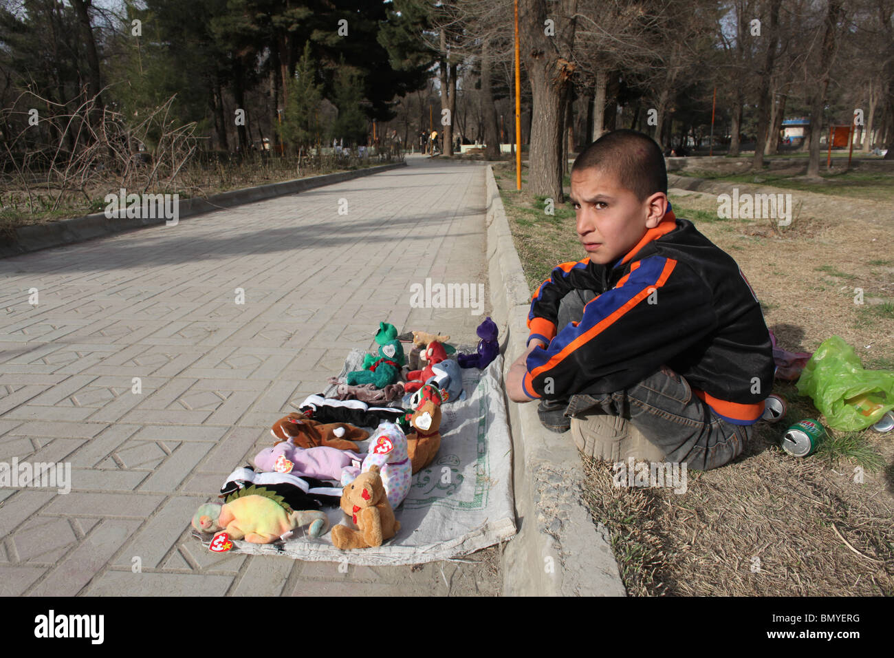 poor children are selling dolls in the streets of kabul Stock Photo - Alamy