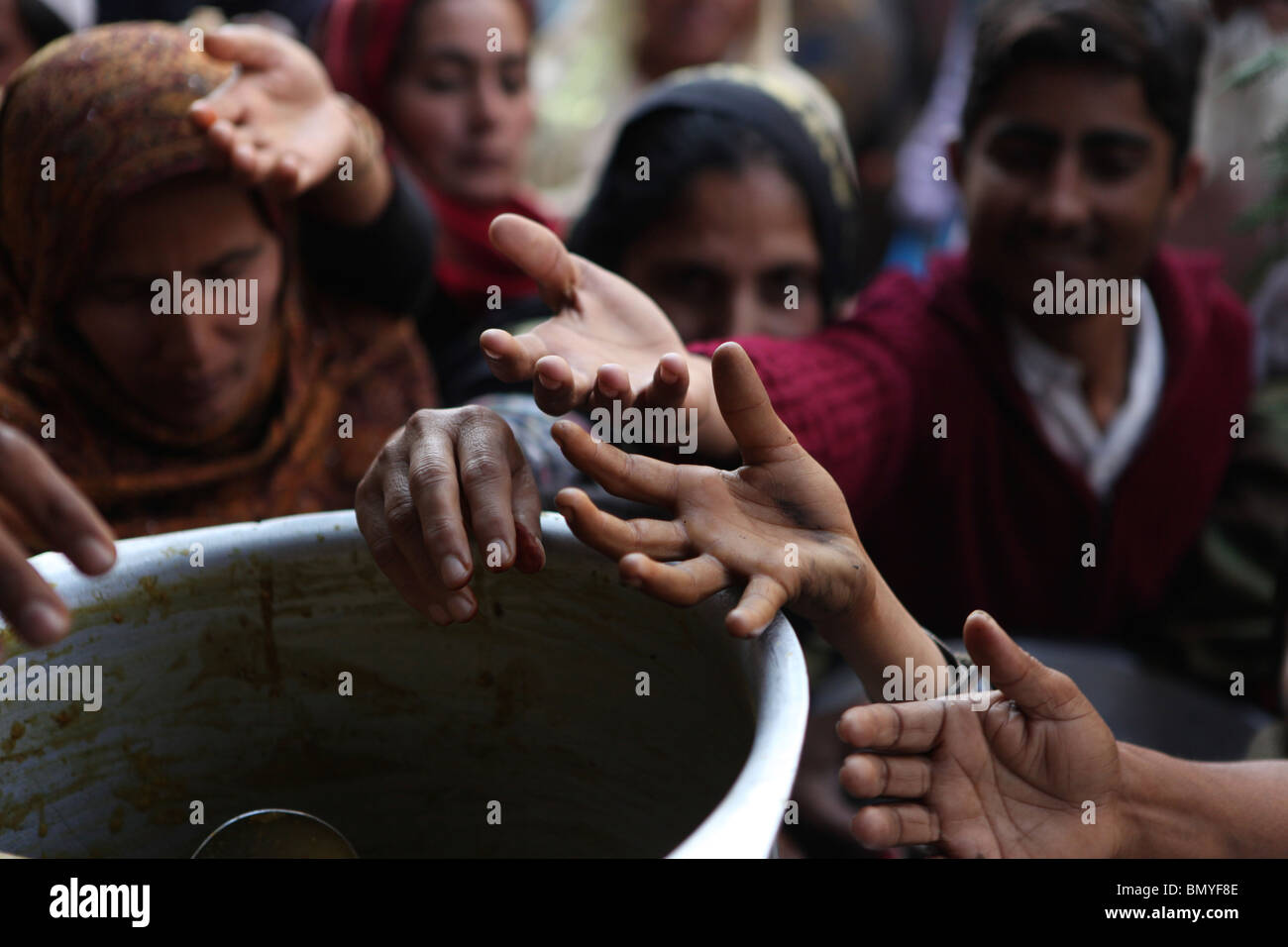 Donation of food to poor people in Pakistan Stock Photo - Alamy