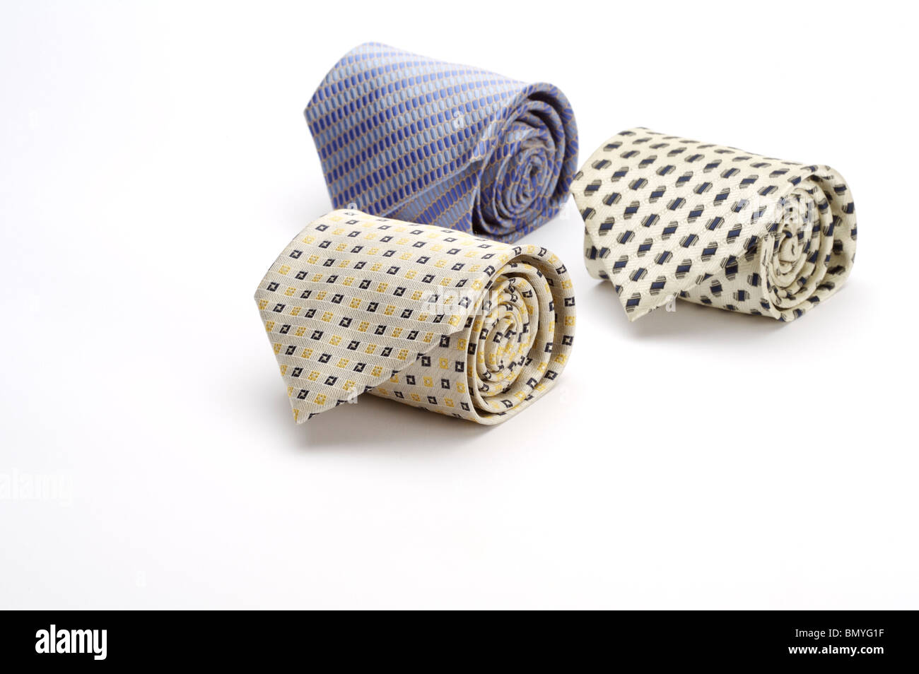 Three Neckties rolled up Stock Photo - Alamy