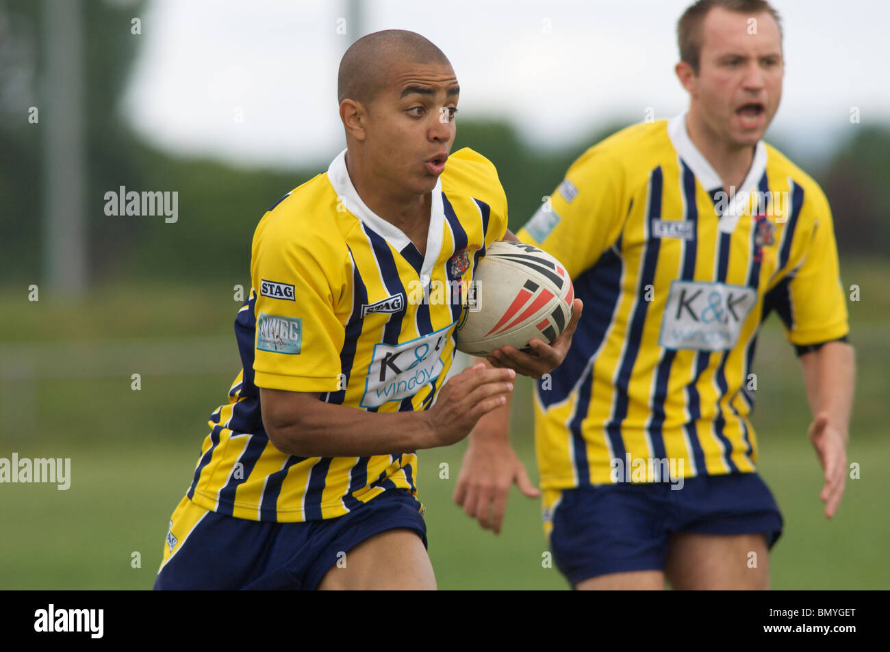 Ellesmere Port player on the attack Stock Photo - Alamy