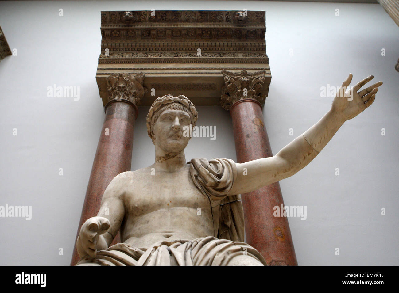 Fragmented statue of a cuirassed Roman emperor with a kneeling ...