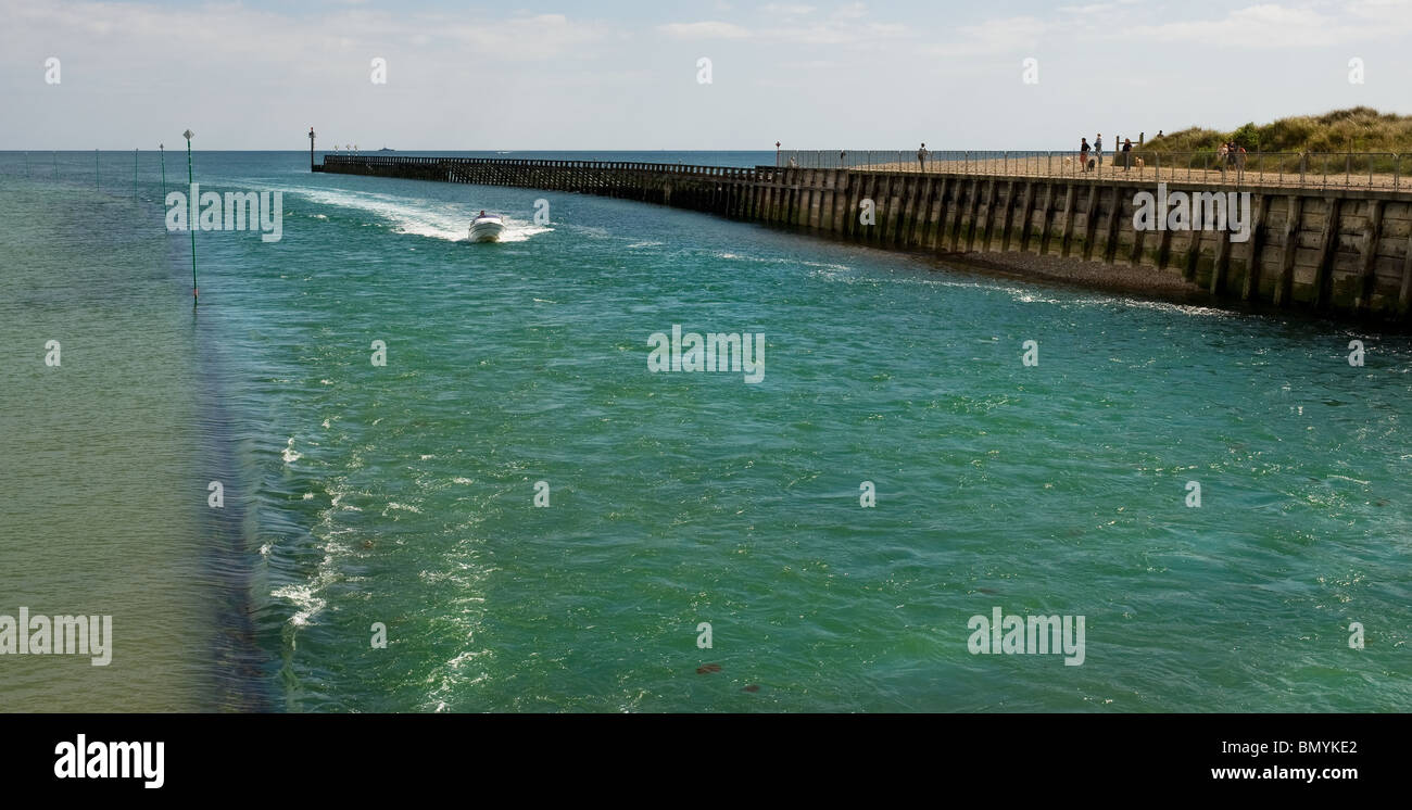 A powerboat entering Littlehampton Harbour in West Sussex. Photo by ...