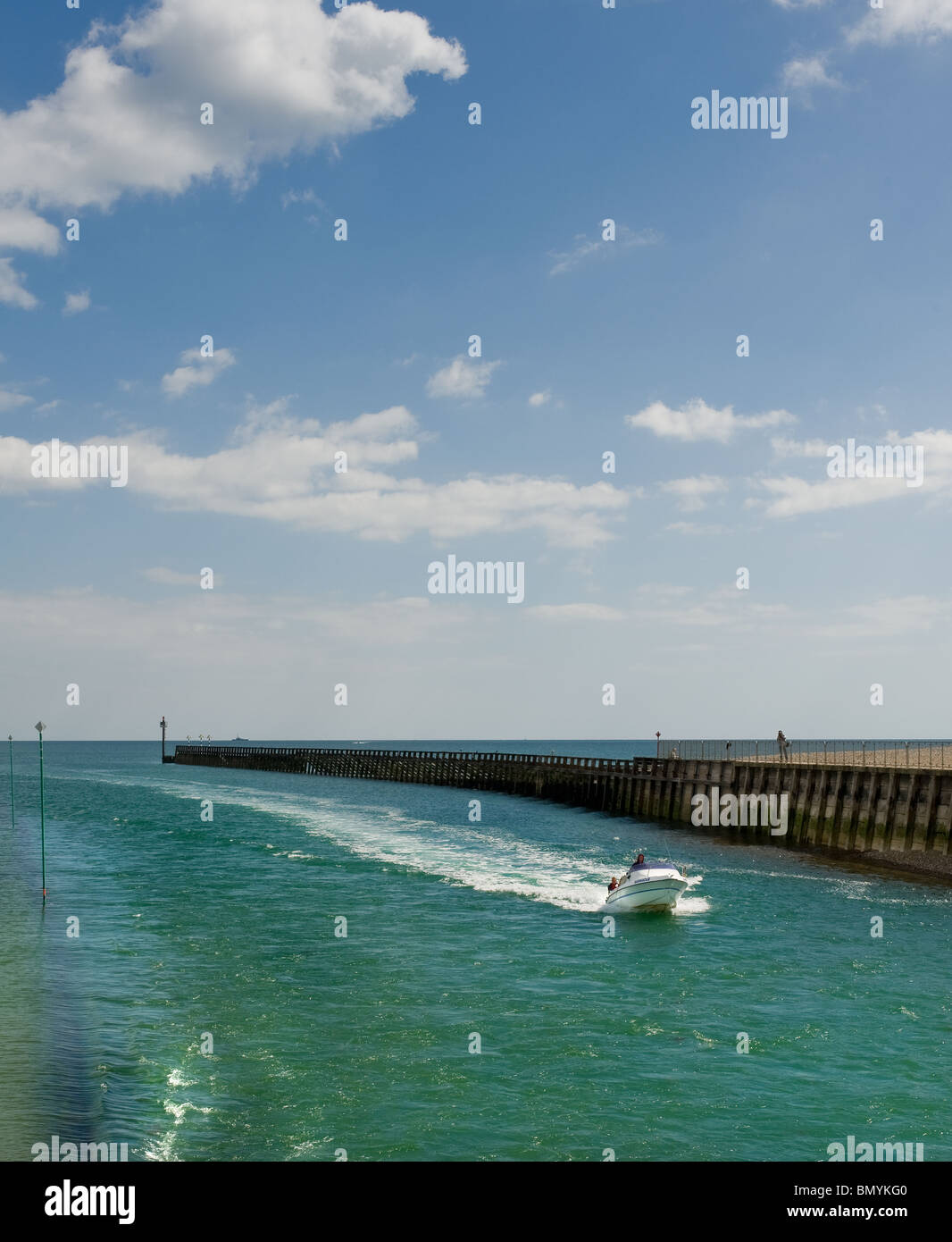 A powerboat entering Littlehampton Harbour in West Sussex. Photo by ...