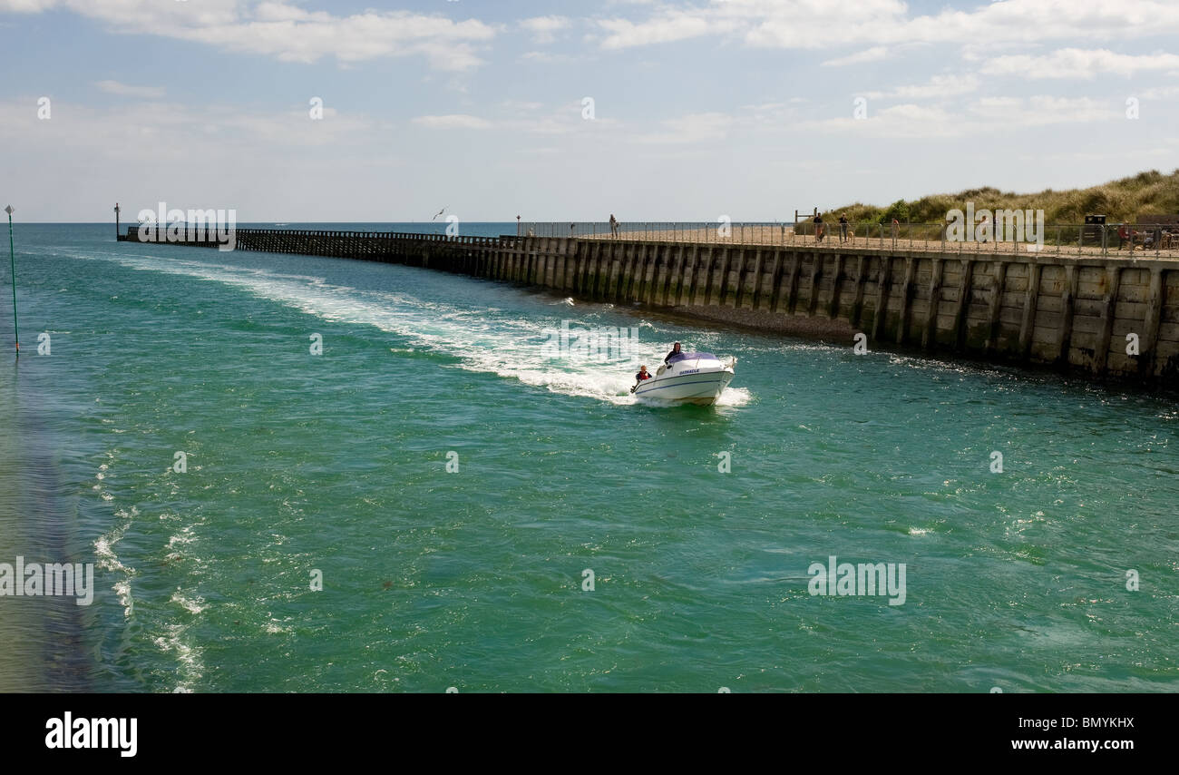 A powerboat entering Littlehampton Harbour in West Sussex. Photo by ...