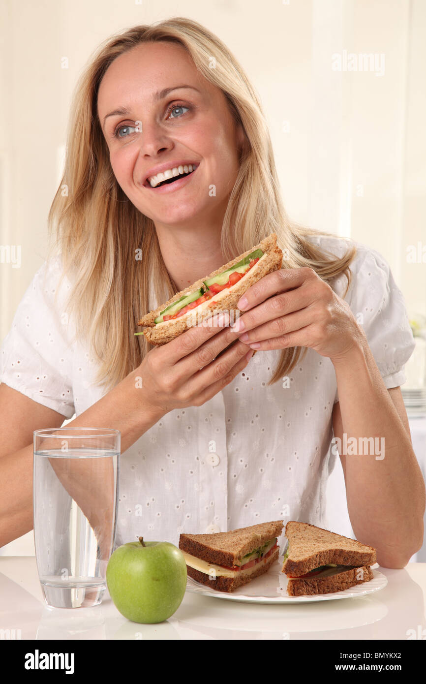 WOMAN EATING LUNCH Stock Photo - Alamy