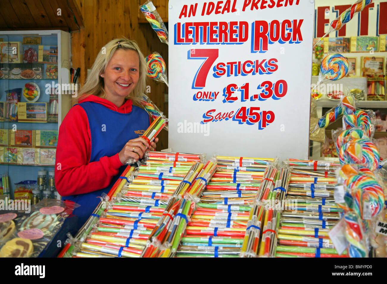 Assistant at work in the Mablethorpe Rock Company shop Stock Photo - Alamy