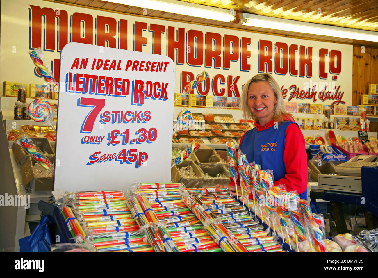 Assistant at work in the Mablethorpe Rock Company shop Stock Photo - Alamy