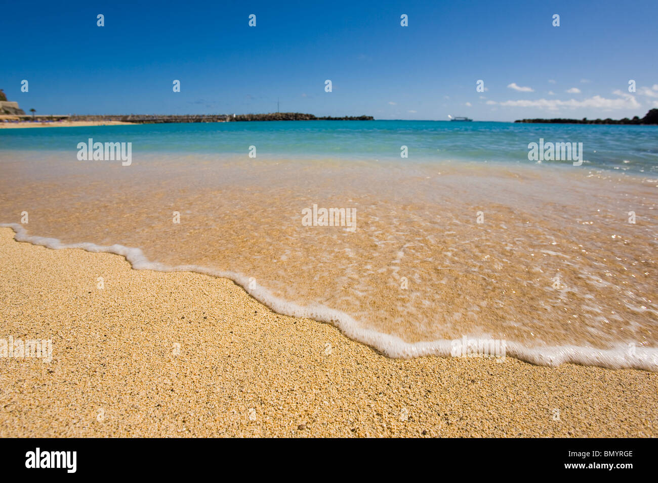 Wave on an empty beach Stock Photo - Alamy