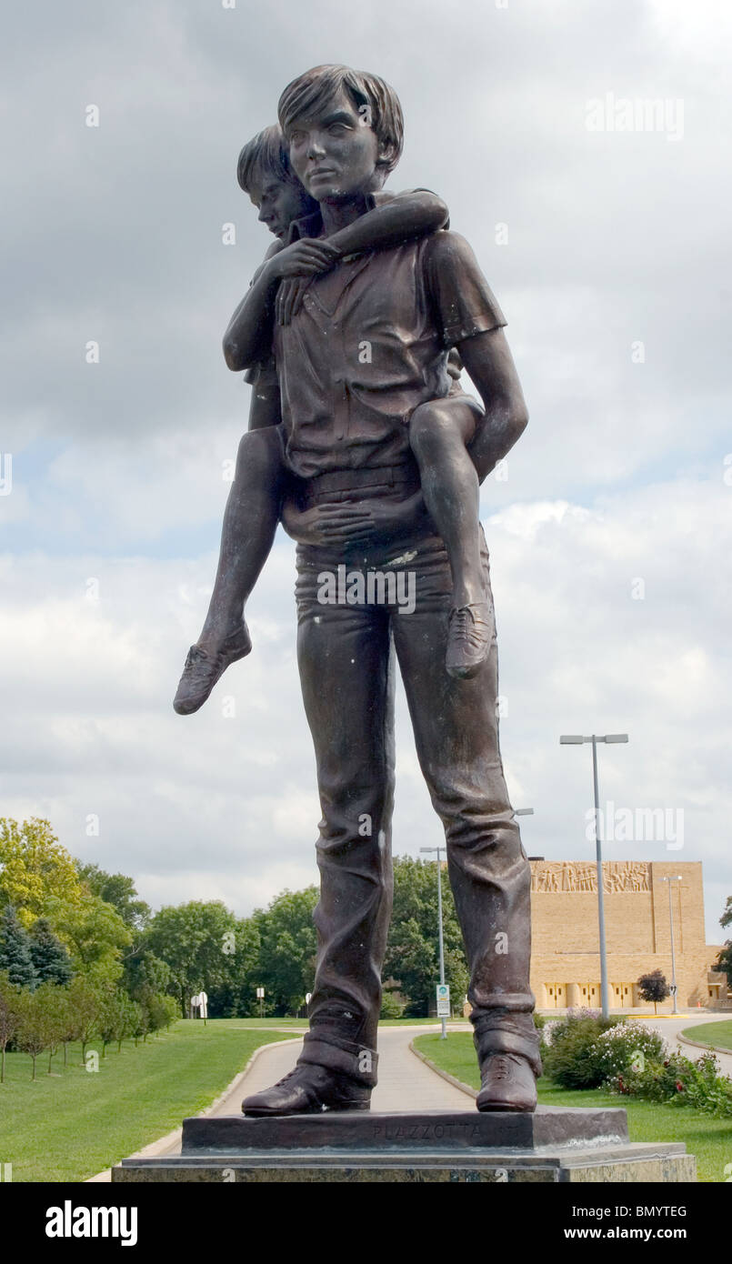 Boys Town Statue of one kid riding piggy back near Omaha Nebraska Stock ...