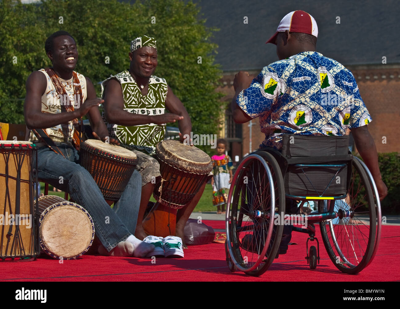 African drummers and happy spectator at African festival Aarhus Denmark ...