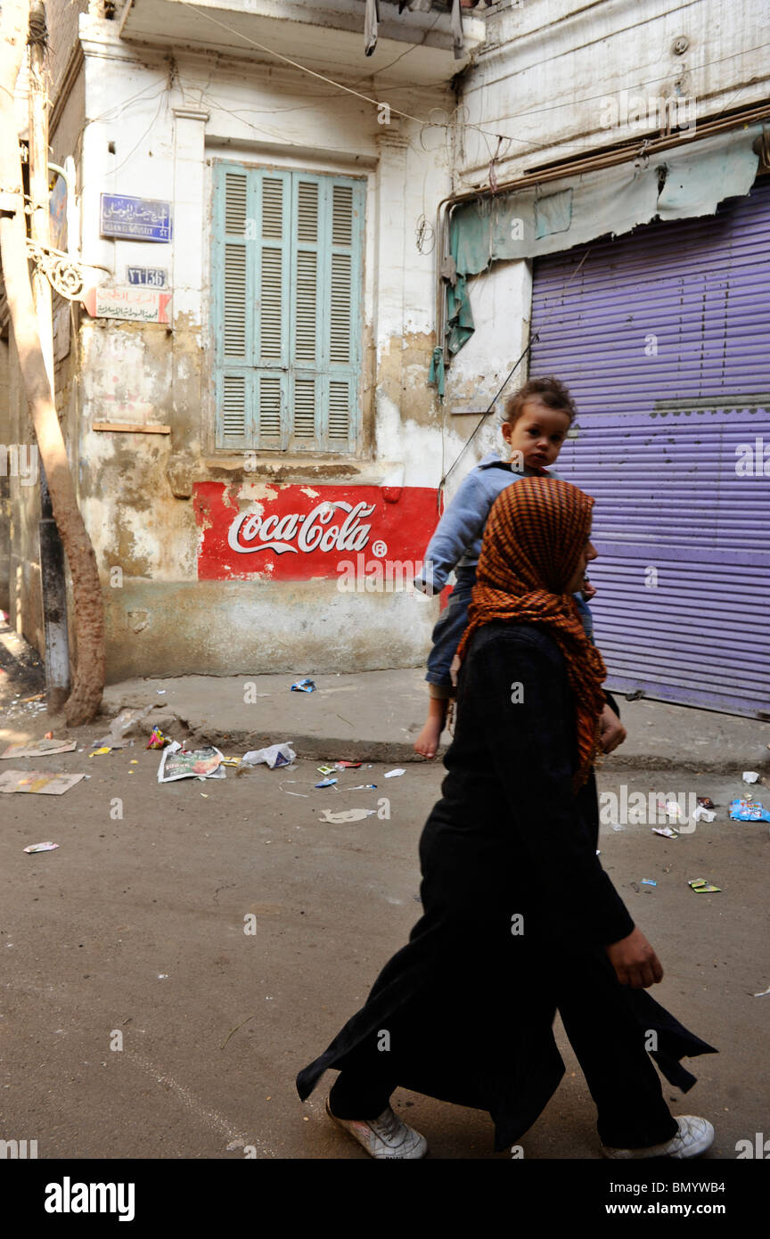 mother and child walking through backstreets of islamic cairo Stock ...