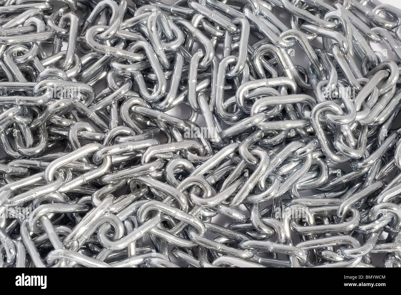 Chains hanging in front of white background Stock Photo - Alamy