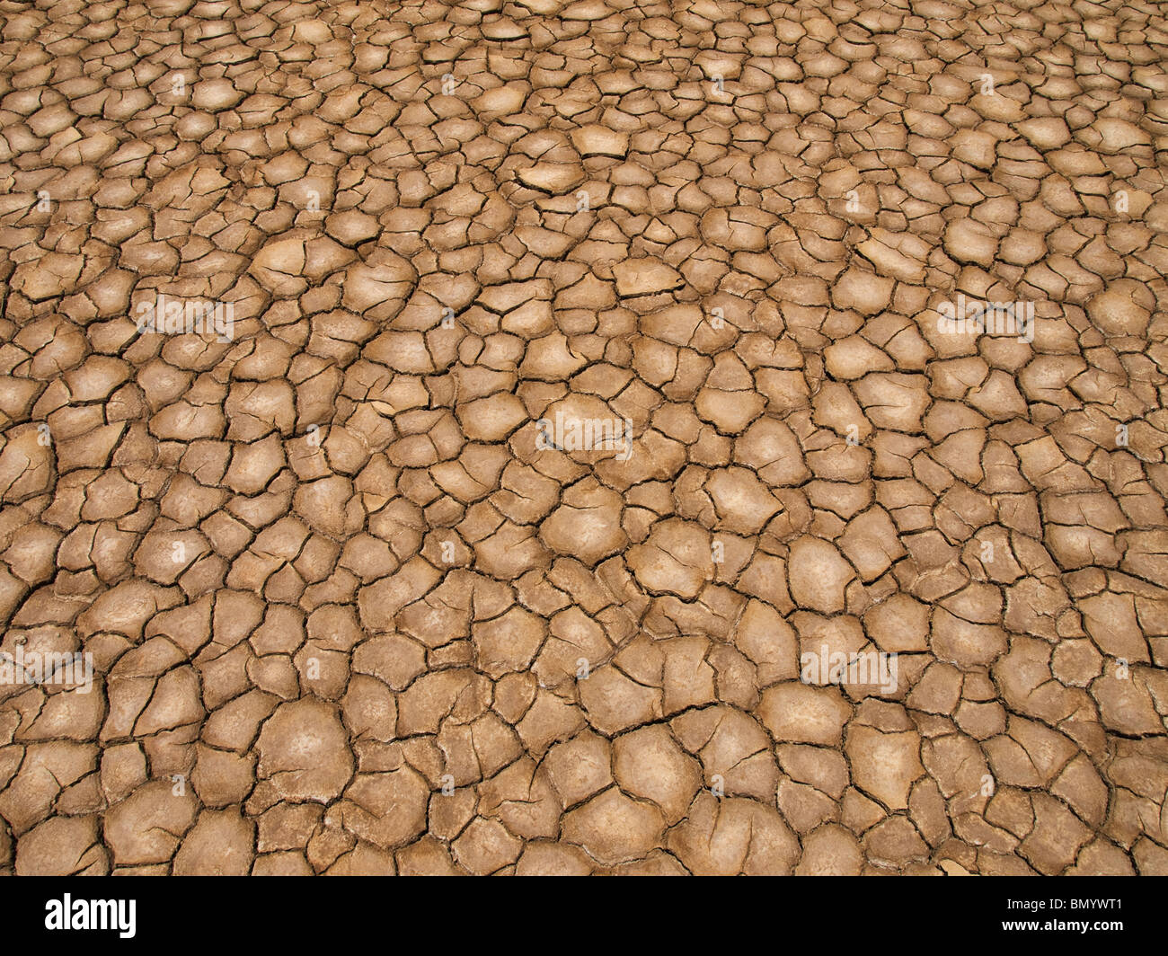 A baked earth soil after a long drought Stock Photo - Alamy