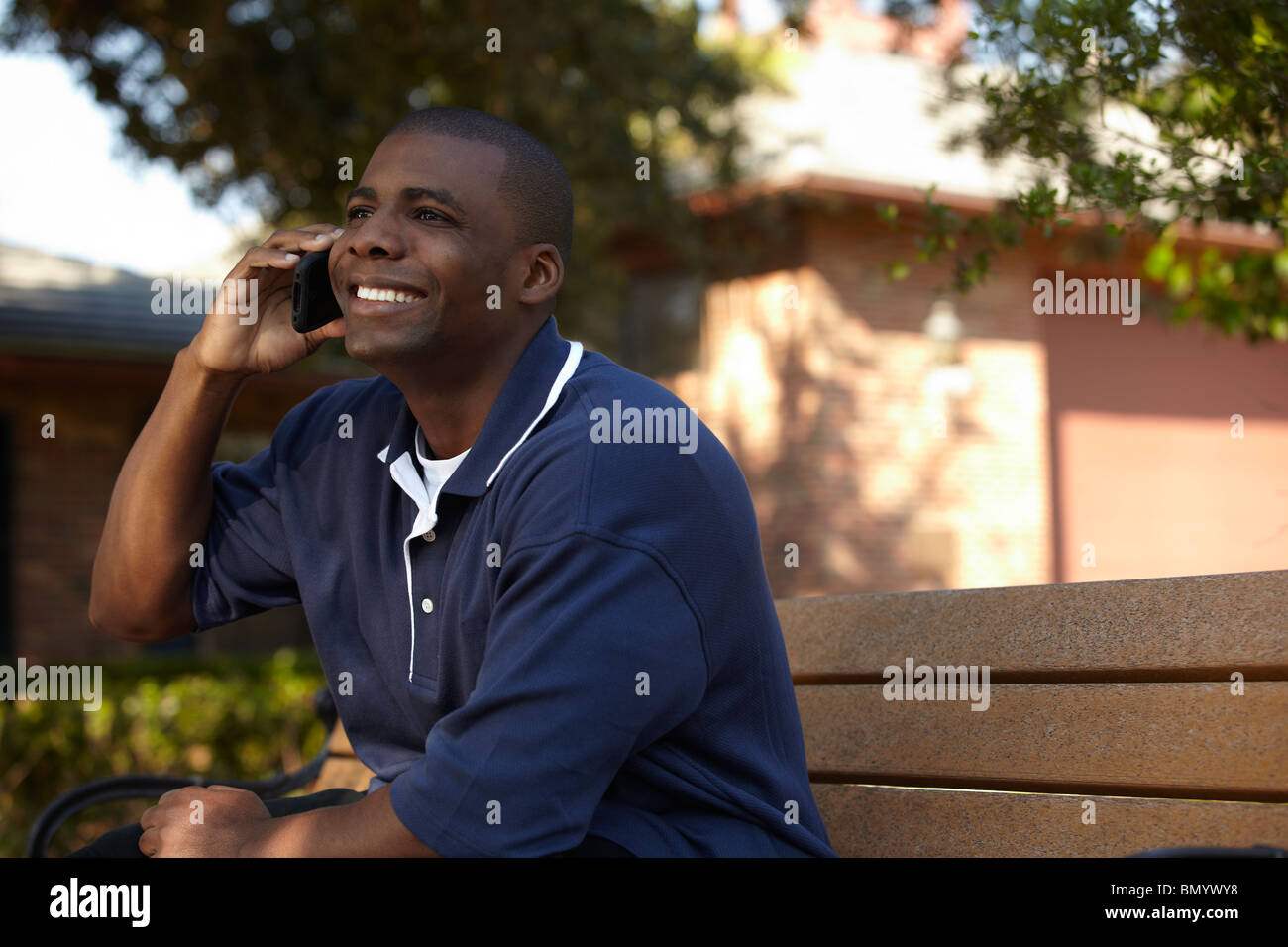 Black man talking on cell phone Stock Photo - Alamy