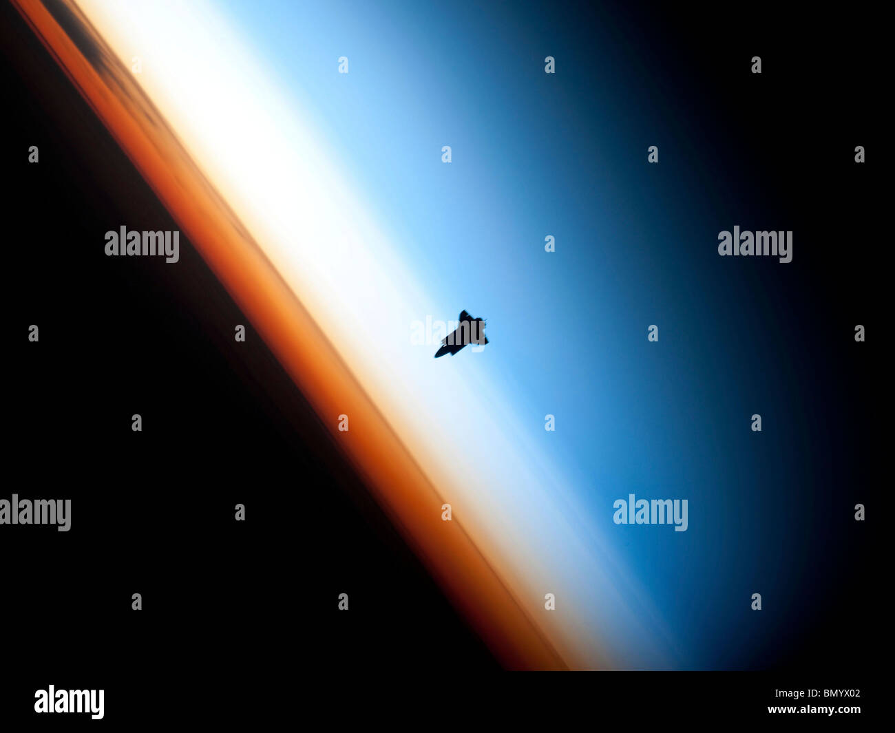 February 9, 2010 - Silhouette of space shuttle Endeavour over Earth's ...