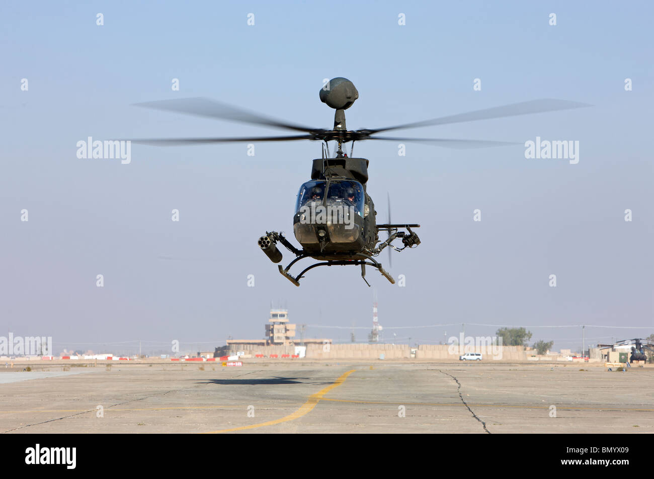 An OH-58D Kiowa Warrior hovers over the flight line at Camp Speicher ...