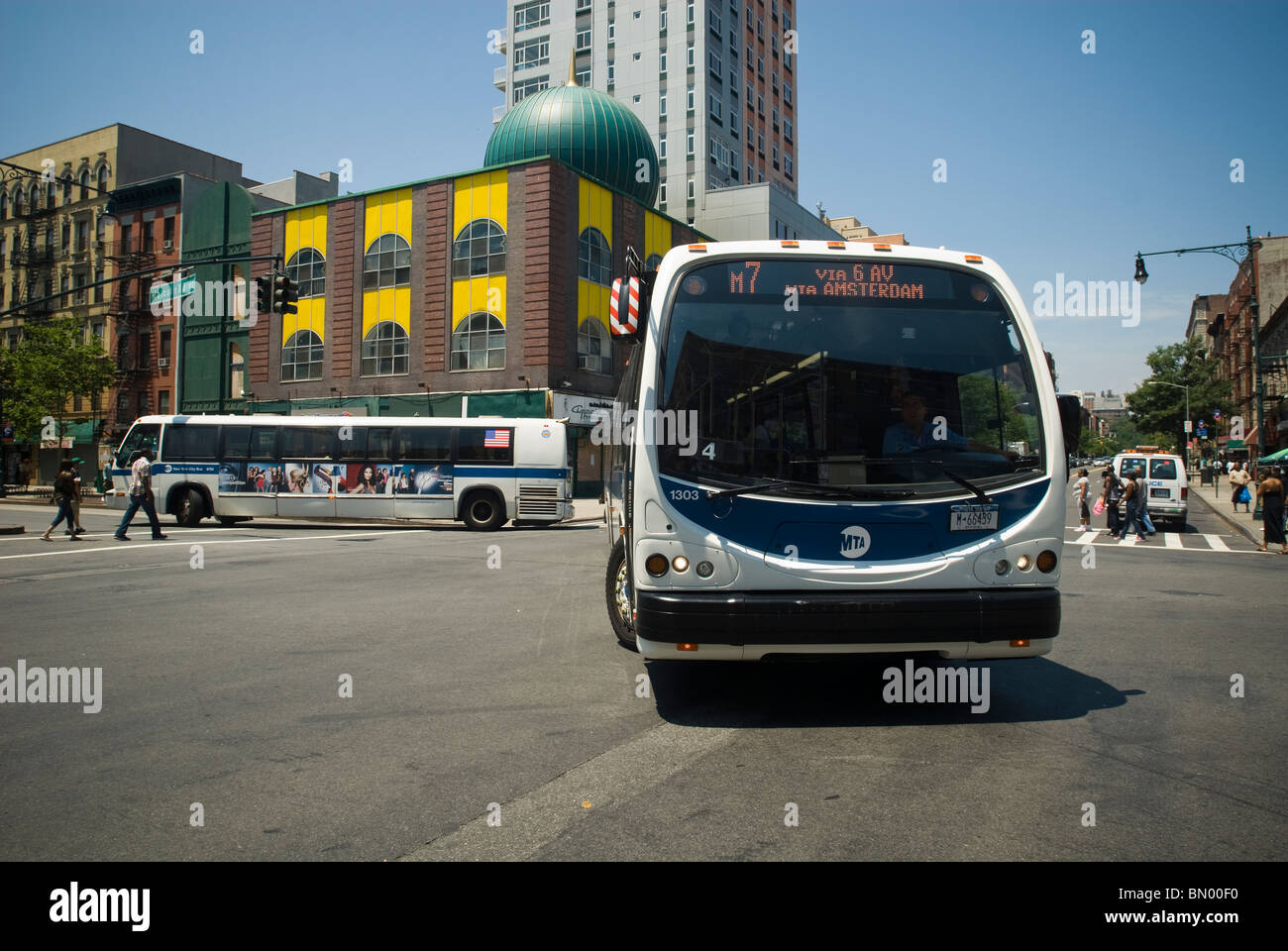 An New York City ECO Saver IV bus by DesignLine turns onto Malcolm X ...