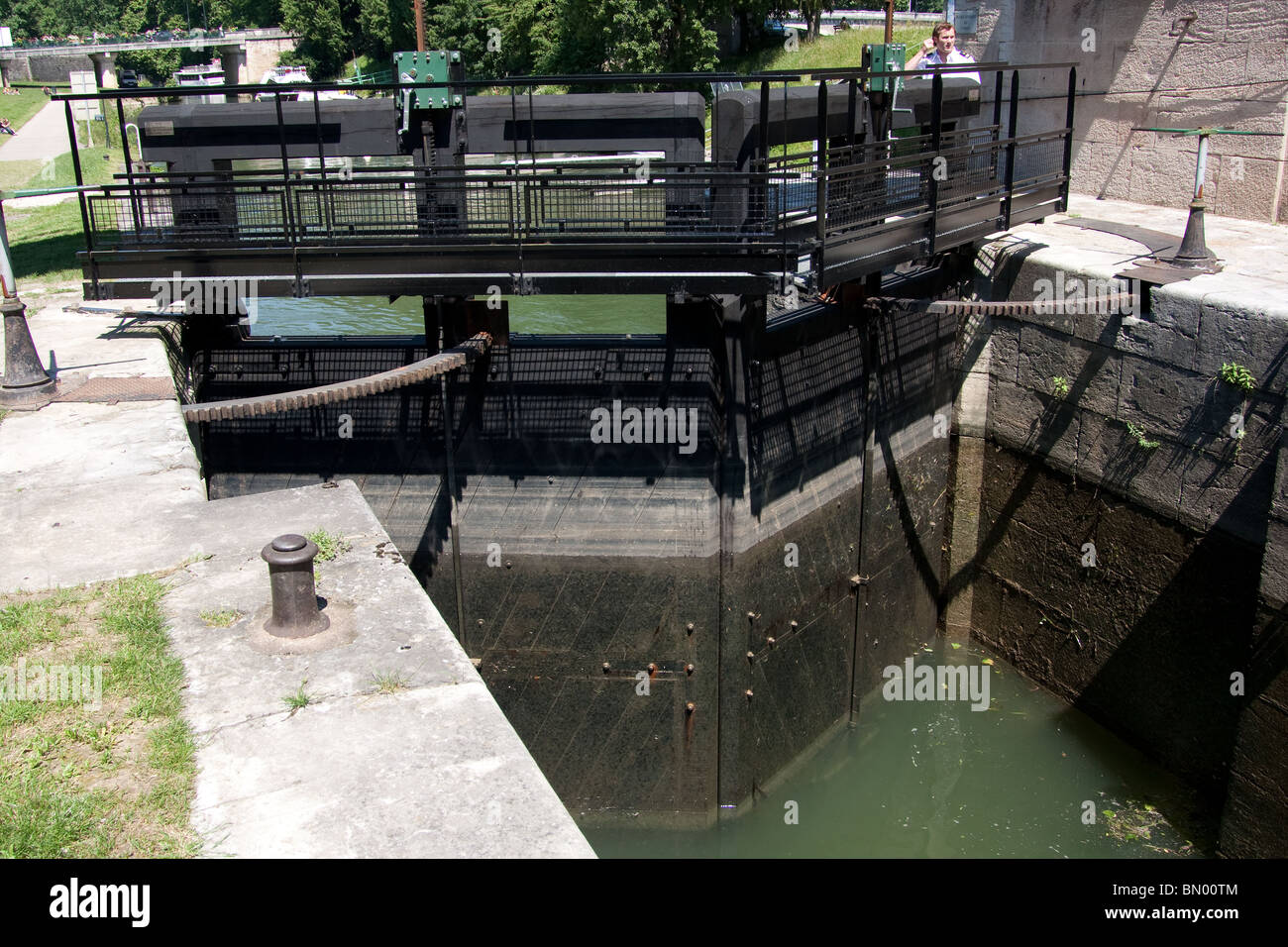 lock entrance river to marina black gates chamber Stock Photo - Alamy
