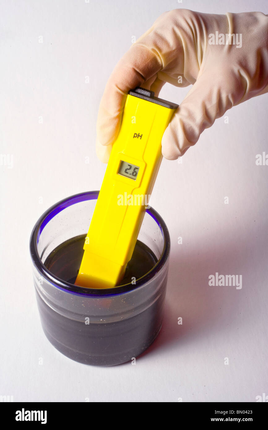 A digital pH meter is used to check the acidity or alkalinity of a ...