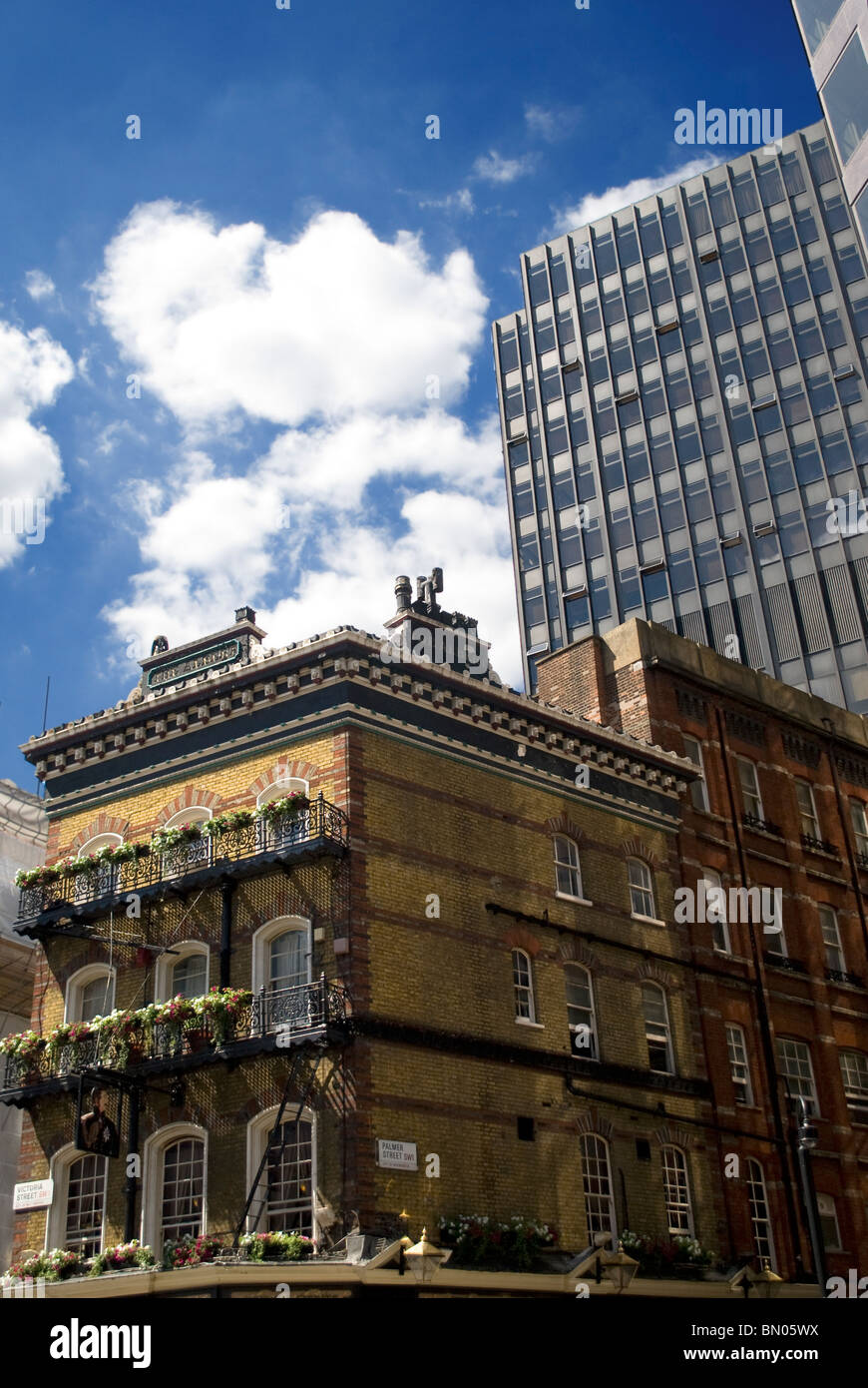 Traditional pub in Victoria street, London with the modern high-rise ...