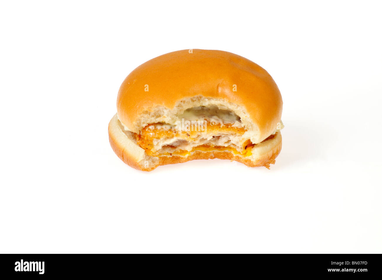 Filet of Fish Sandwich in bun with a bite out of it on white background ...