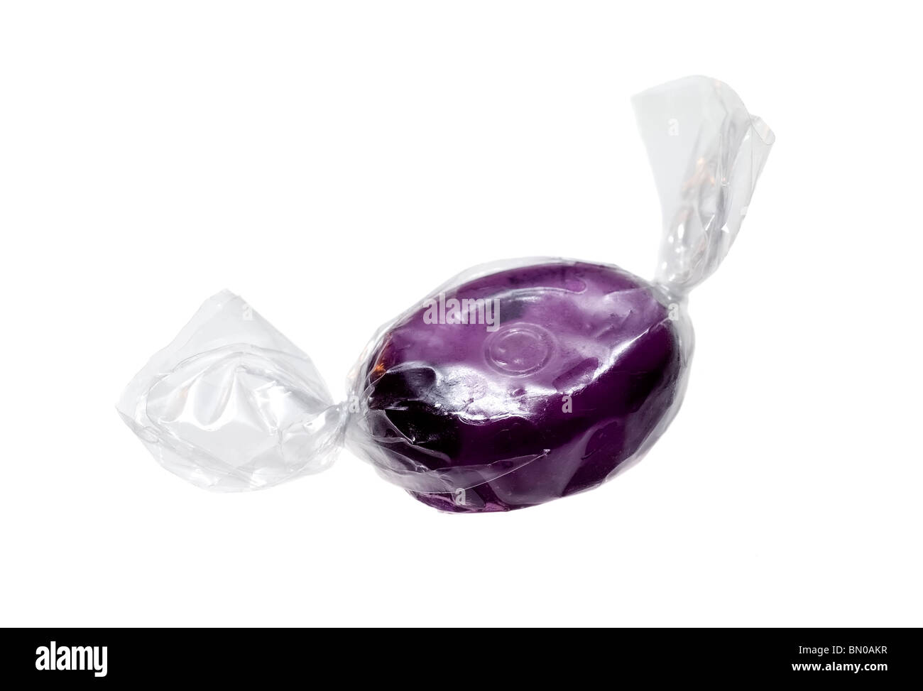 There is a sweet in transparent package Stock Photo - Alamy