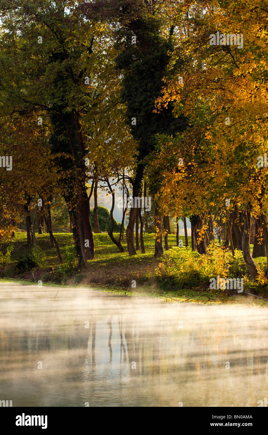 Fog rising over the river in the autumn evening Stock Photo - Alamy