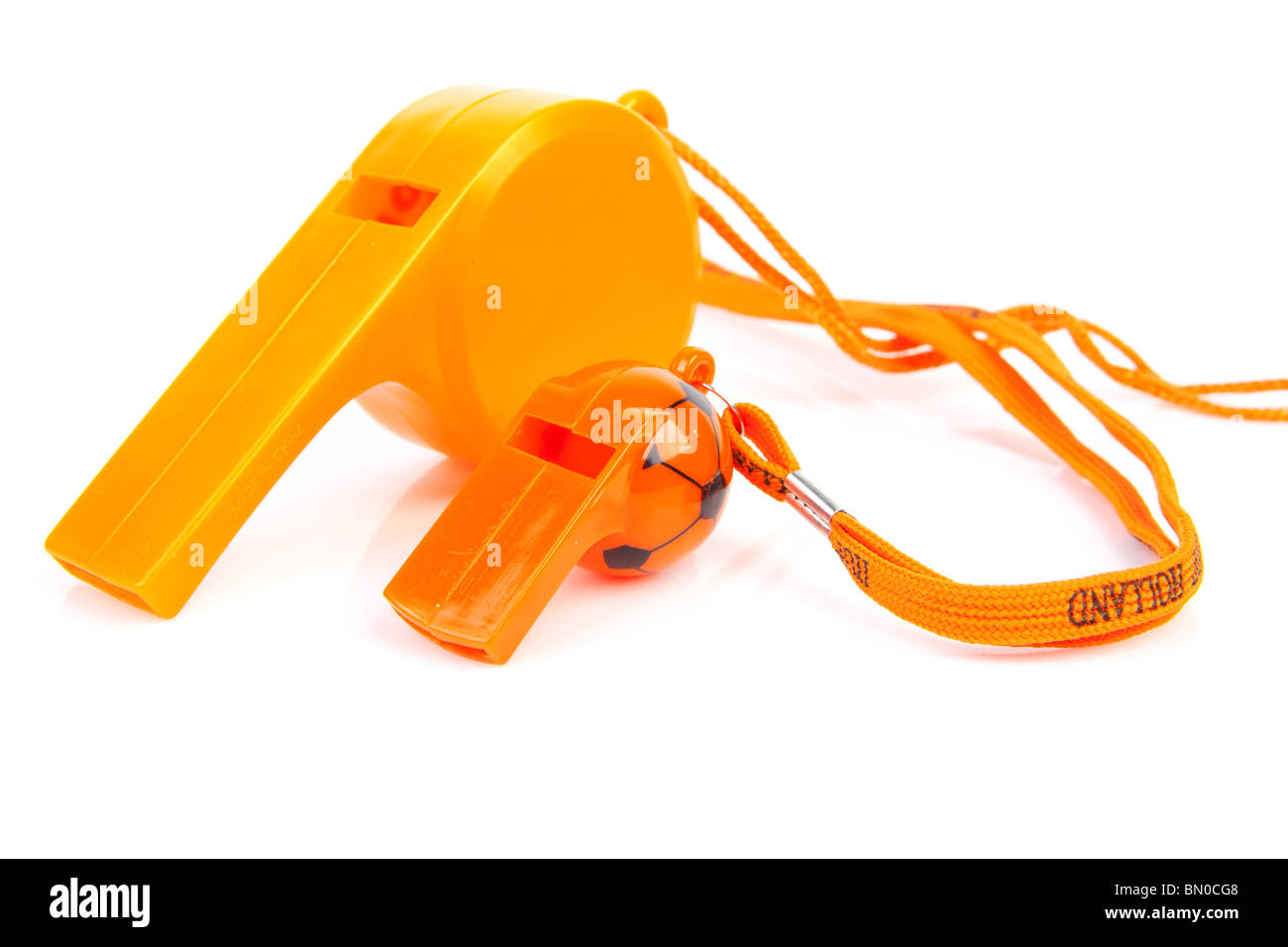 Two orange soccer flutes isolated on white background Stock Photo - Alamy